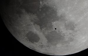 Round object crosses the moon | Human World | EarthSky