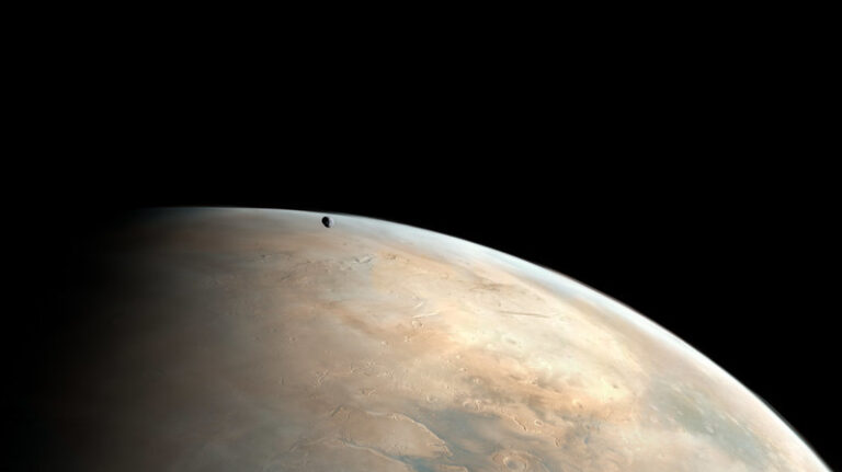 See the Martian moon Phobos fly over a dust storm